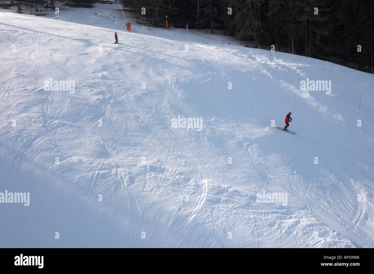 Skiers ski down the mountain at Montchavin les Coches in the French ...