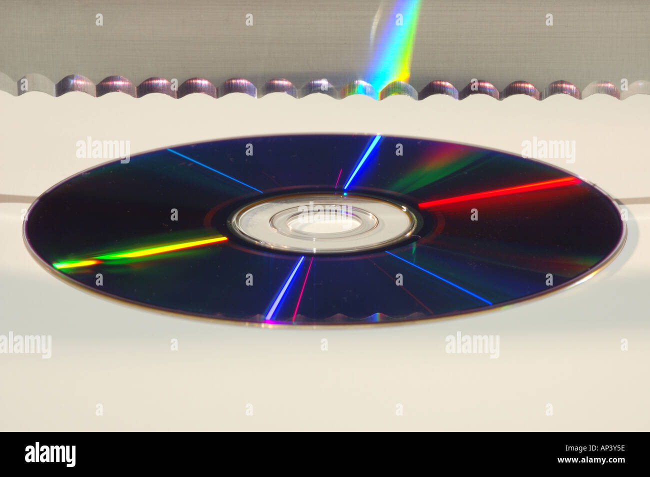 A disc is shown reflecting multi-colored lights on its surface while ...