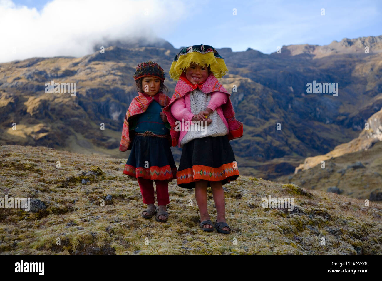 Two Peruvian children in the Andes mountains in traditional clothing ...
