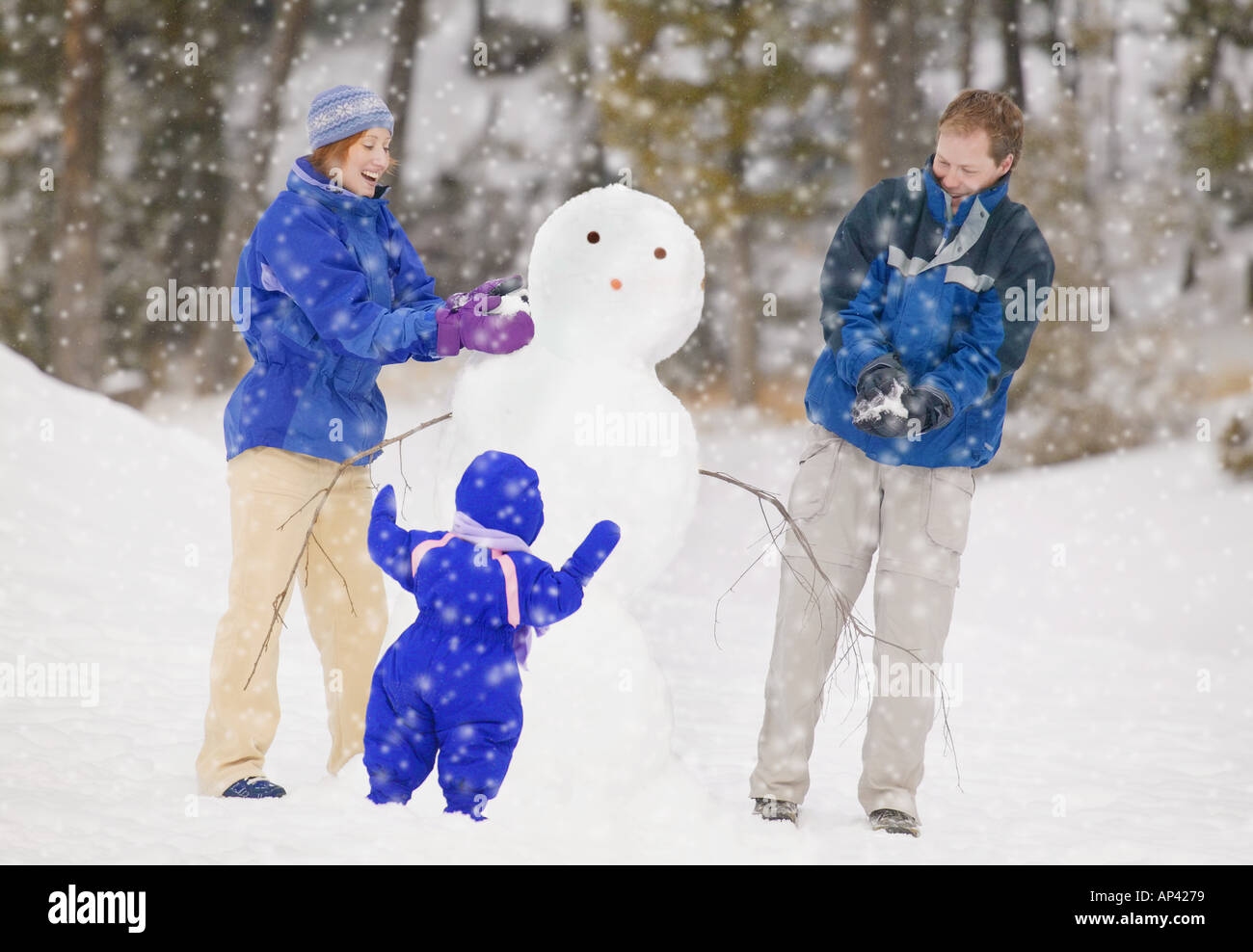 Building a snowman Stock Photo - Alamy