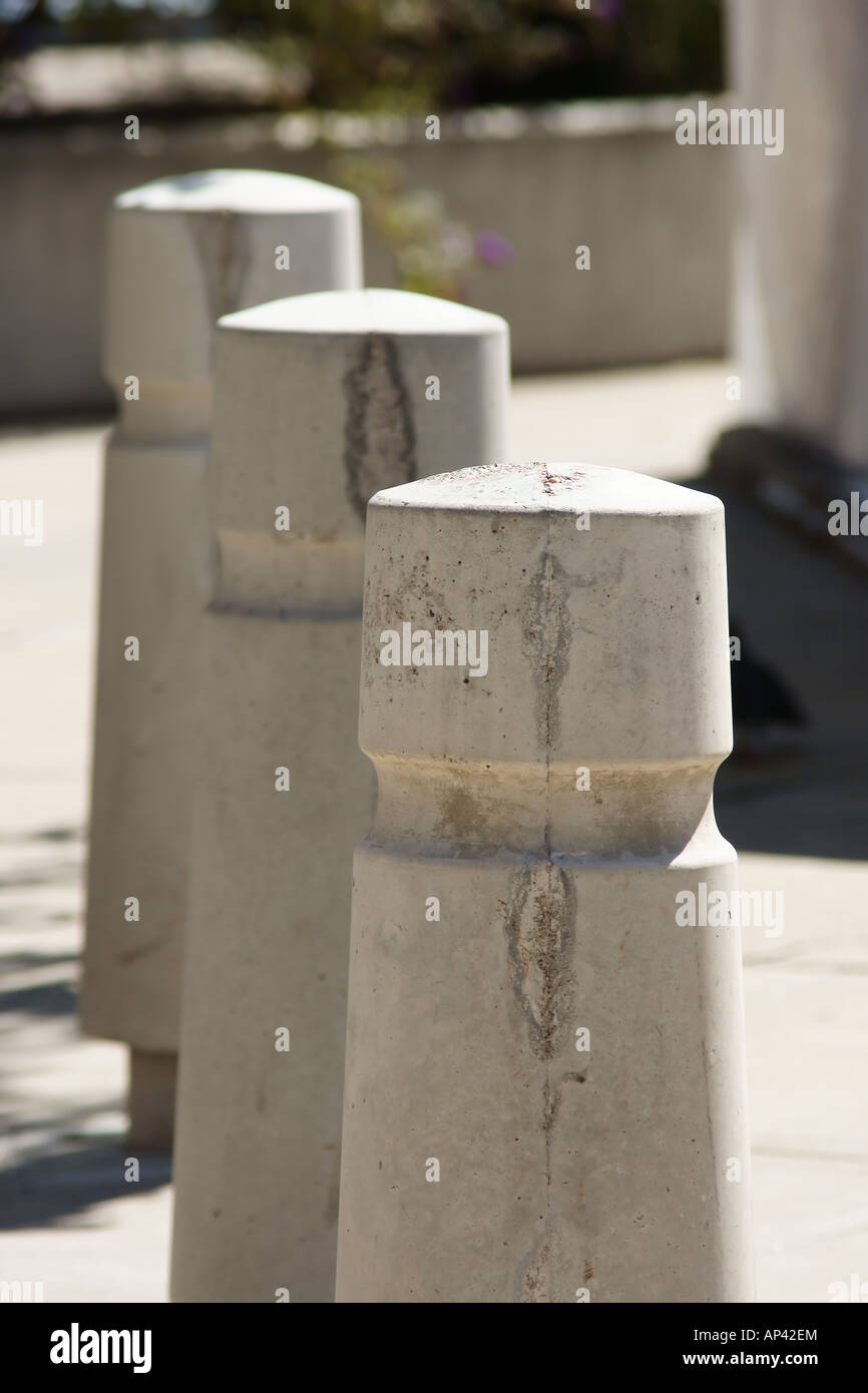 Cement road blocks guarding a walkway Stock Photo - Alamy