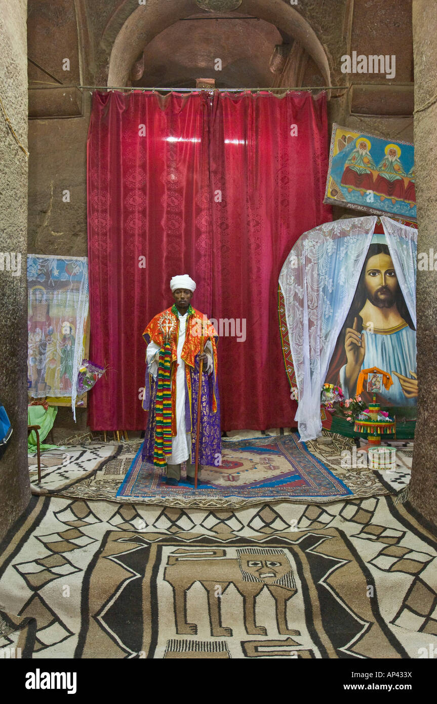 A priest poses for the camera in the Bete Medhane Alem mononlithic ...