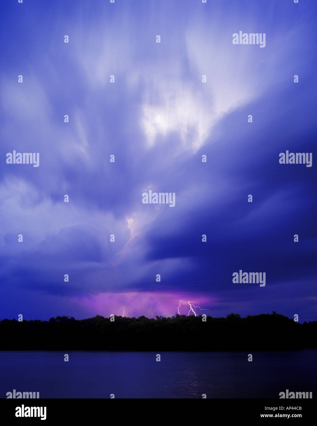 Cloudy sky with lightning in the distance Stock Photo - Alamy