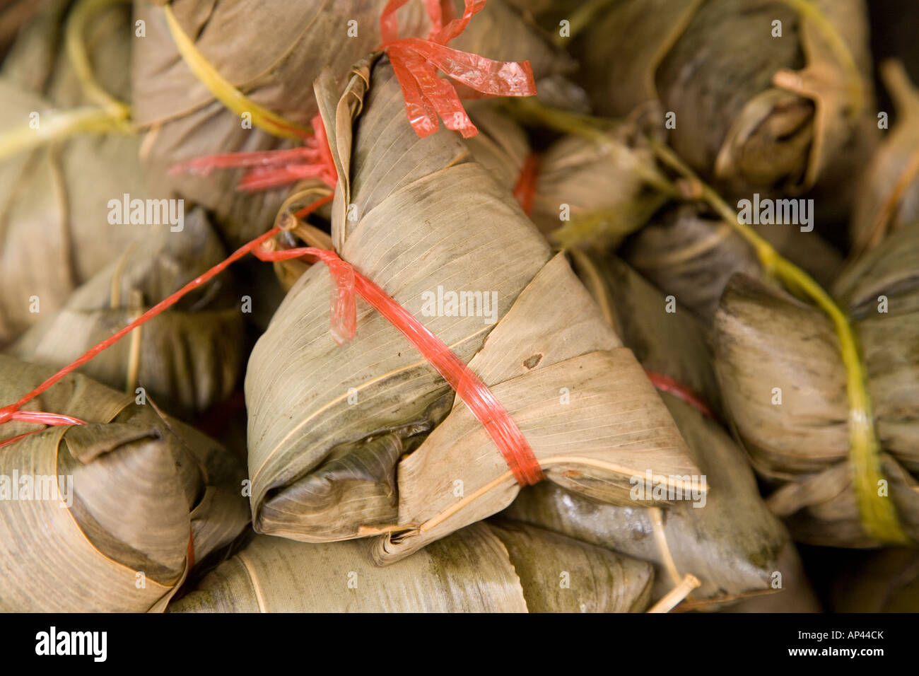 Sticky rice wrapped in banana leaf, for sale on a market stall in Kuala ...