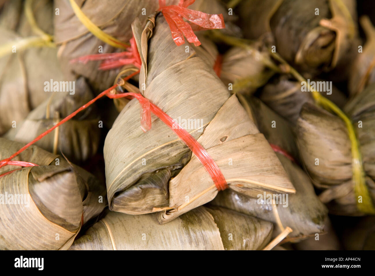 Sticky rice wrapped in banana leaf, for sale on a market stall in Kuala ...