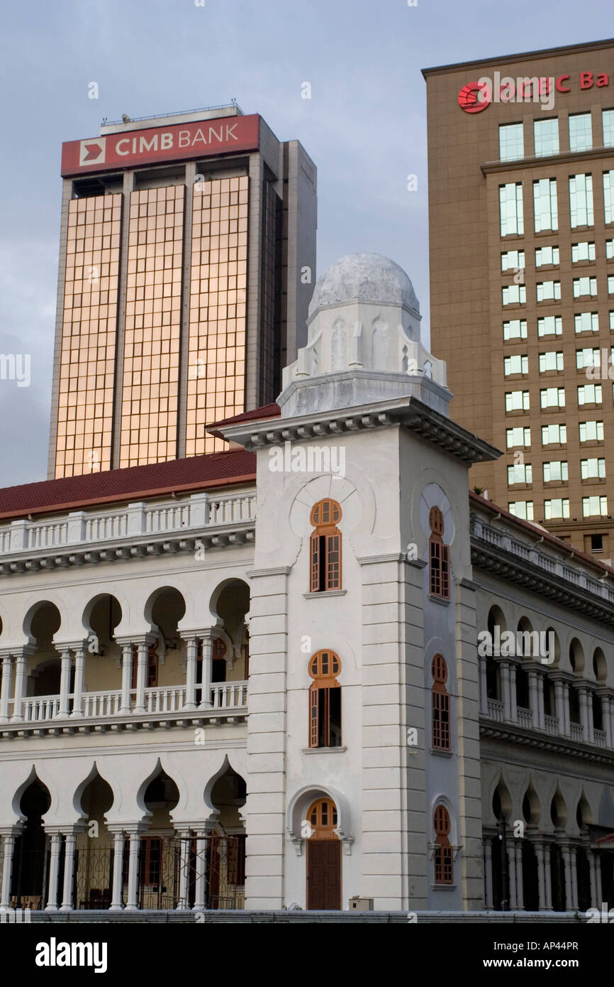 Two banks tower over a building with architecture influenced by Islamic ...