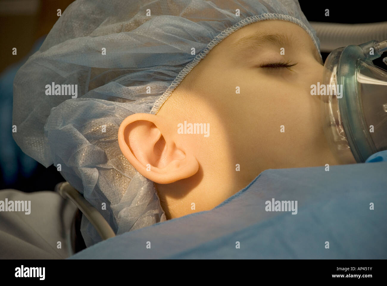 Young boy undergoing ear surgery in hospital operating room Stock Photo ...