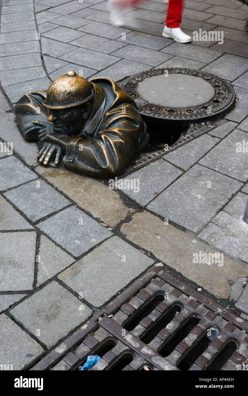 sculpture manhole, old town, Bratislava, Slovakia Stock Photo - Alamy