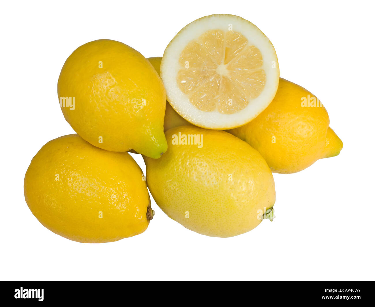 ripe lemons pile with a lemon sliced Stock Photo - Alamy