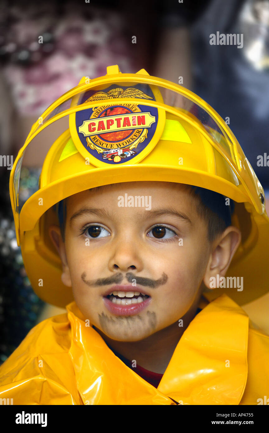 Little boy dressed like a fireman at Halloween Stock Photo - Alamy