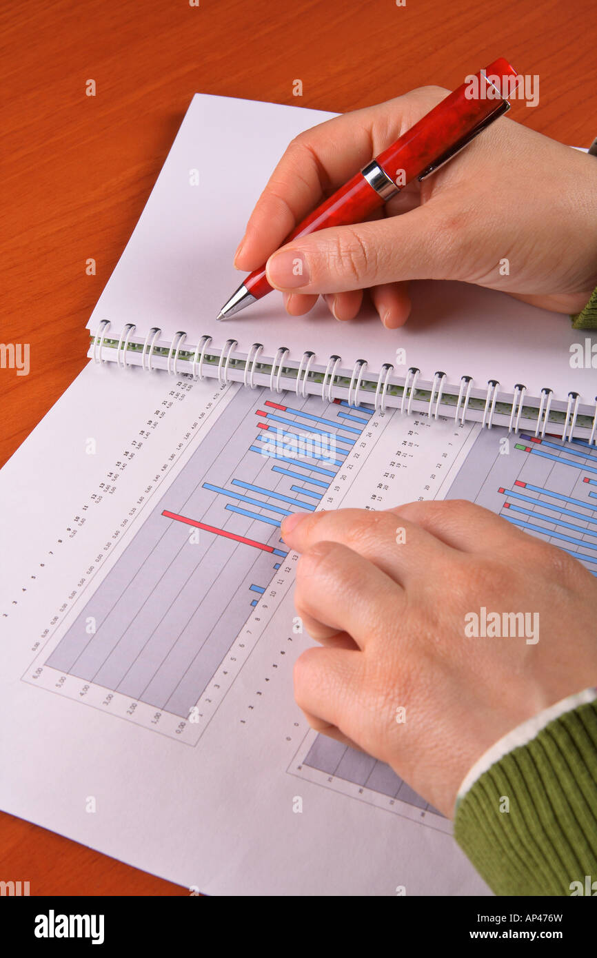 Businessman writing on paper chart hi-res stock photography and images ...