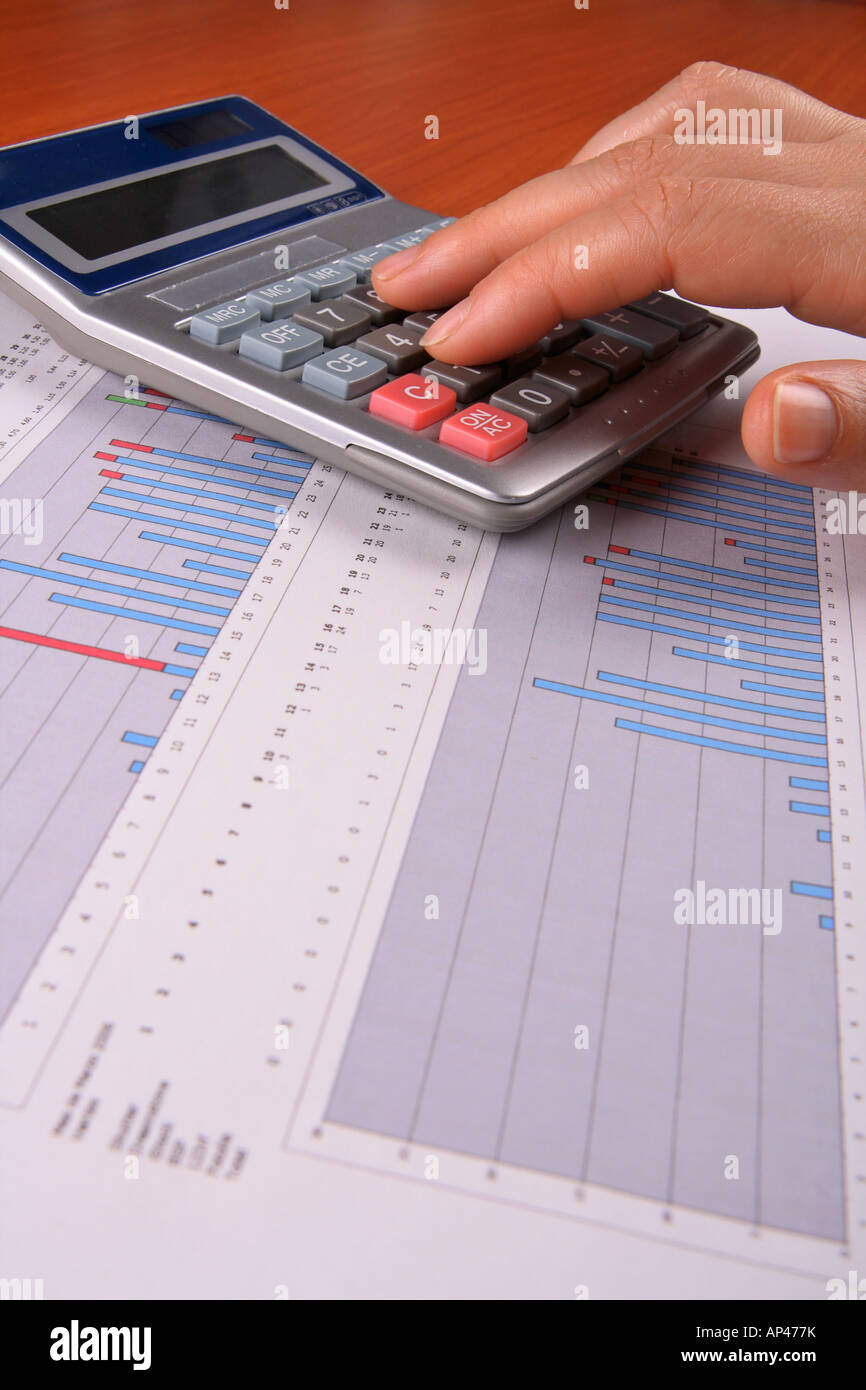 Business woman calculating over the stock chart Stock Photo - Alamy