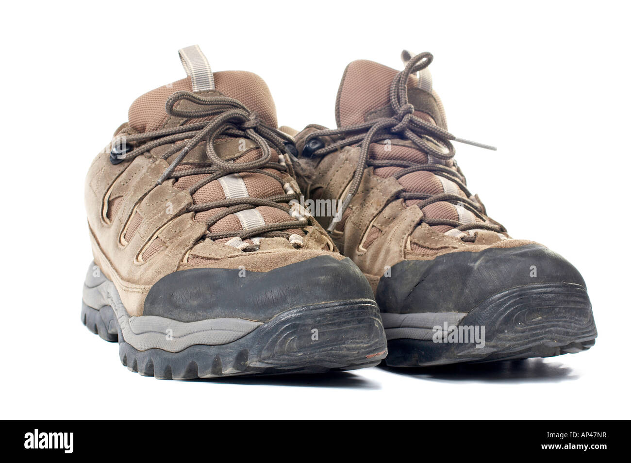 A pair of used hiking boots with shadow over a white background Stock ...