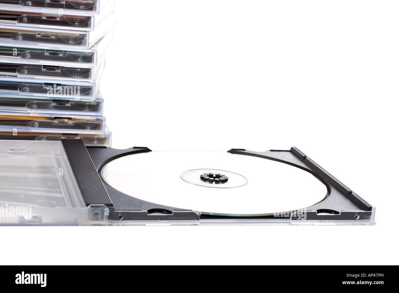 CD box open ahead of cds stack over a white background Stock Photo - Alamy