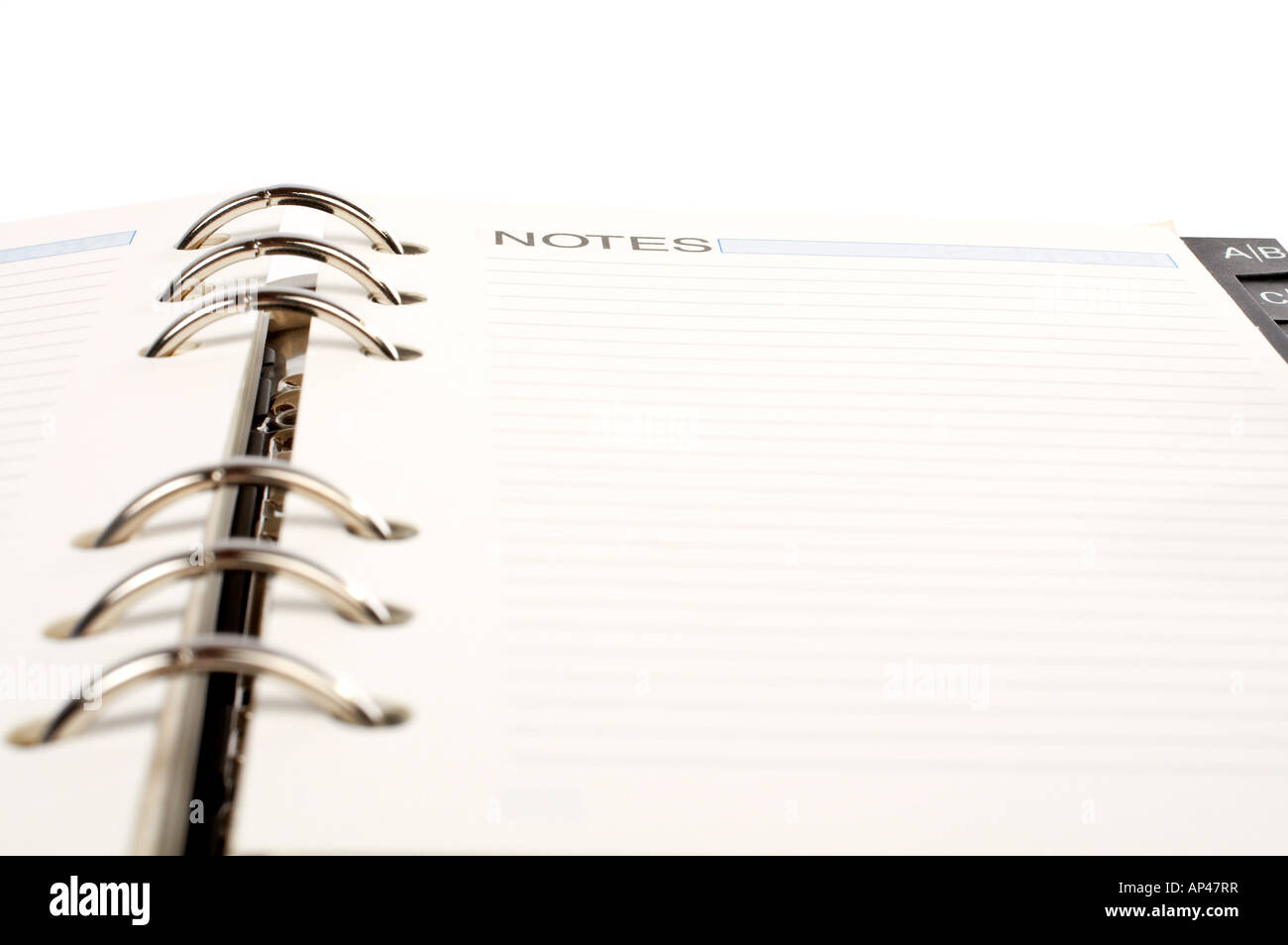 Opened agenda with the notes word written over a white background Small ...