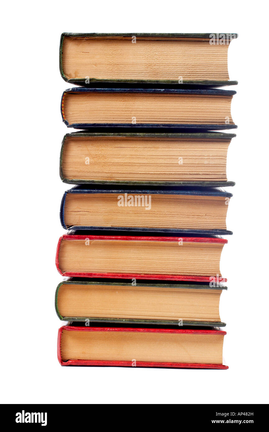 A vertical pile of books isolated on white background Stock Photo - Alamy