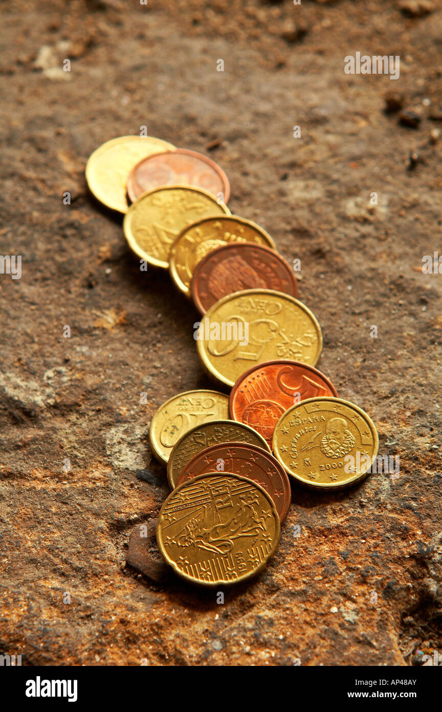 A stack of coins over the stone background Shallow DOF Stock Photo - Alamy