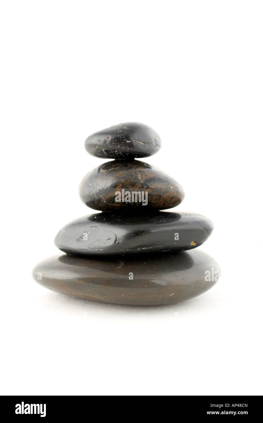 Stack of balanced stones with shadow on white background Stock Photo ...