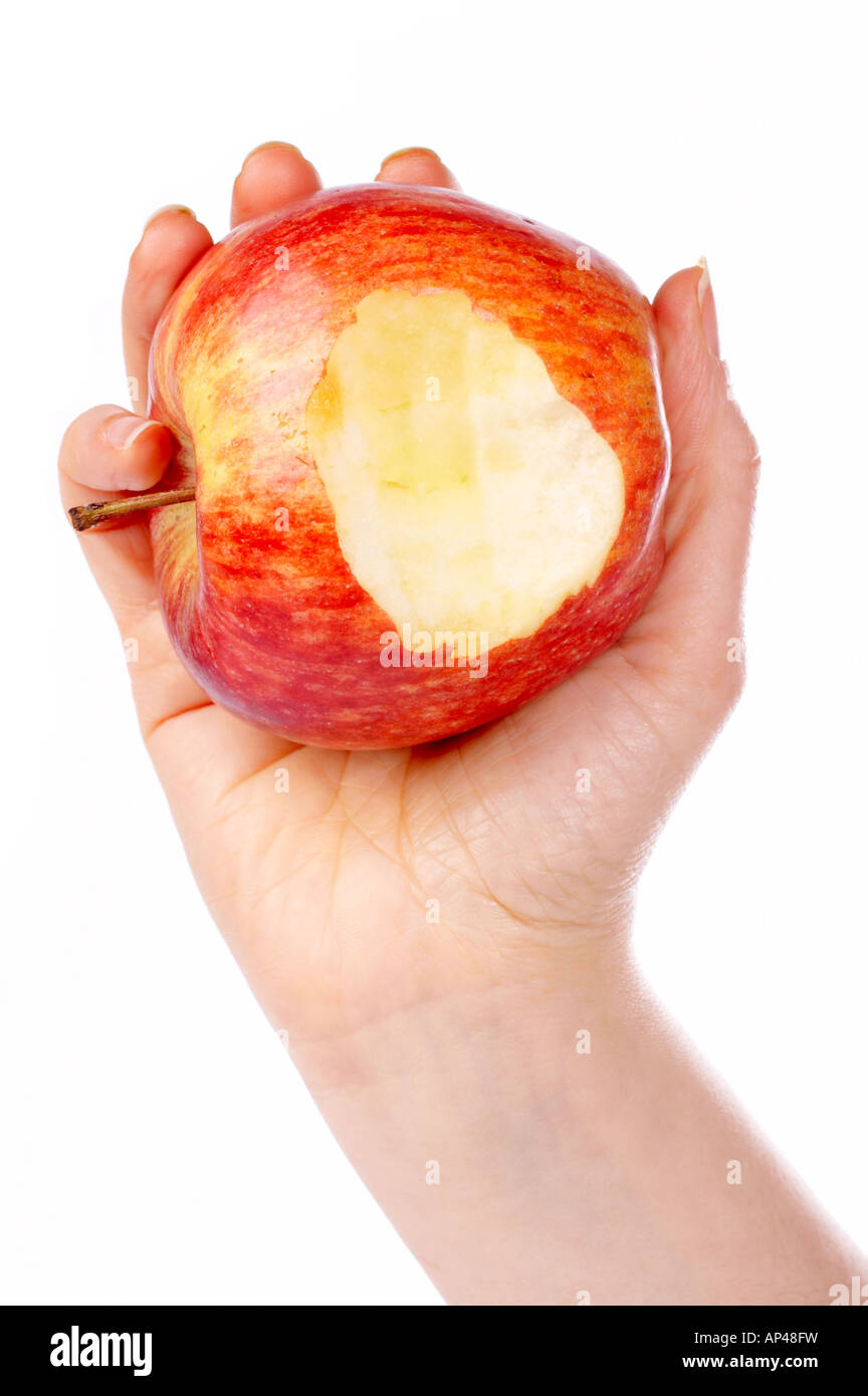 Holding a red apple with one bite on the white background Stock Photo ...