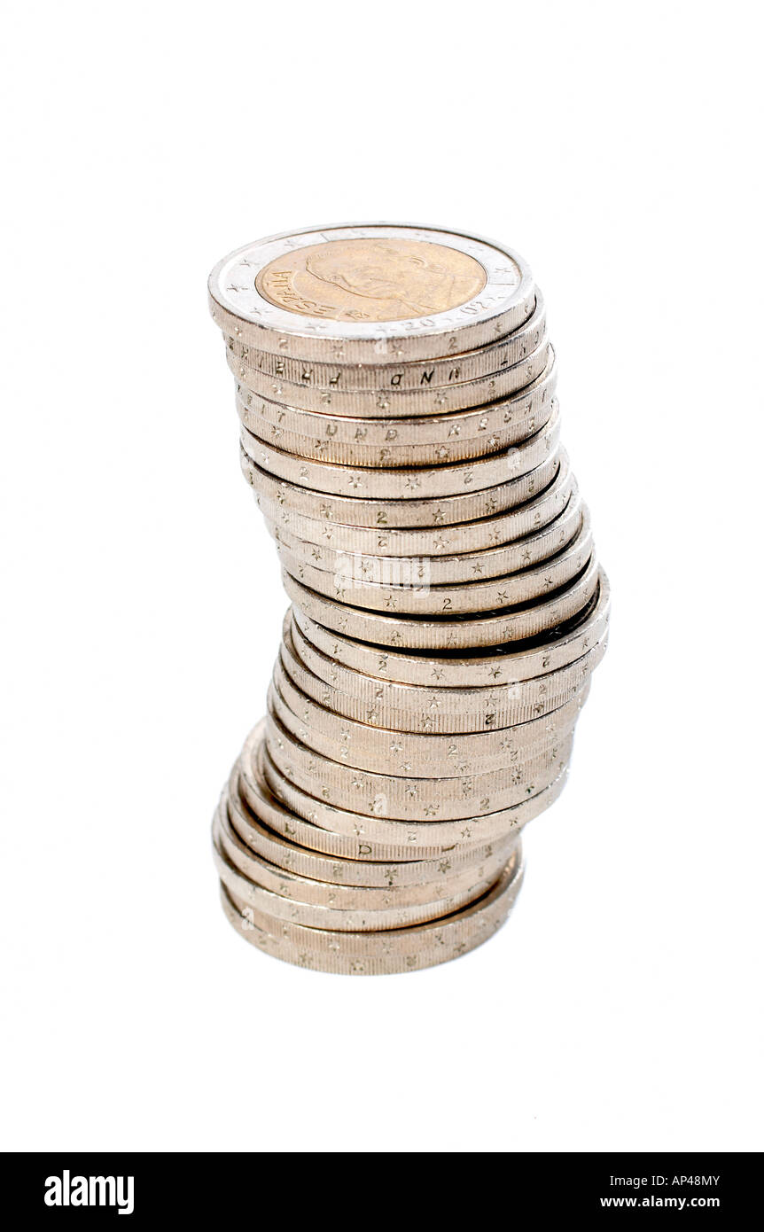 Vertical stack of coins on white background Stock Photo - Alamy