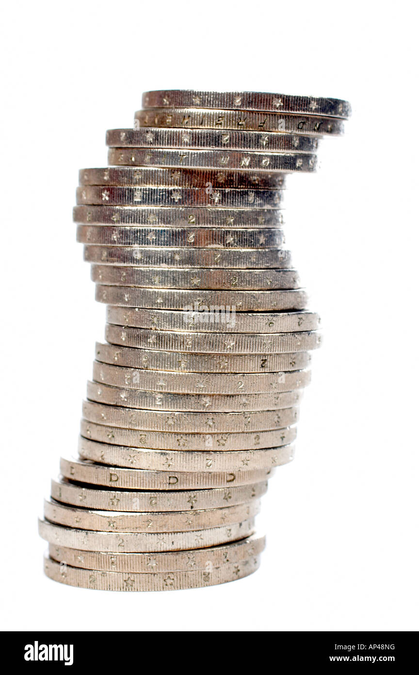Vertical stack of coins on white background Stock Photo - Alamy