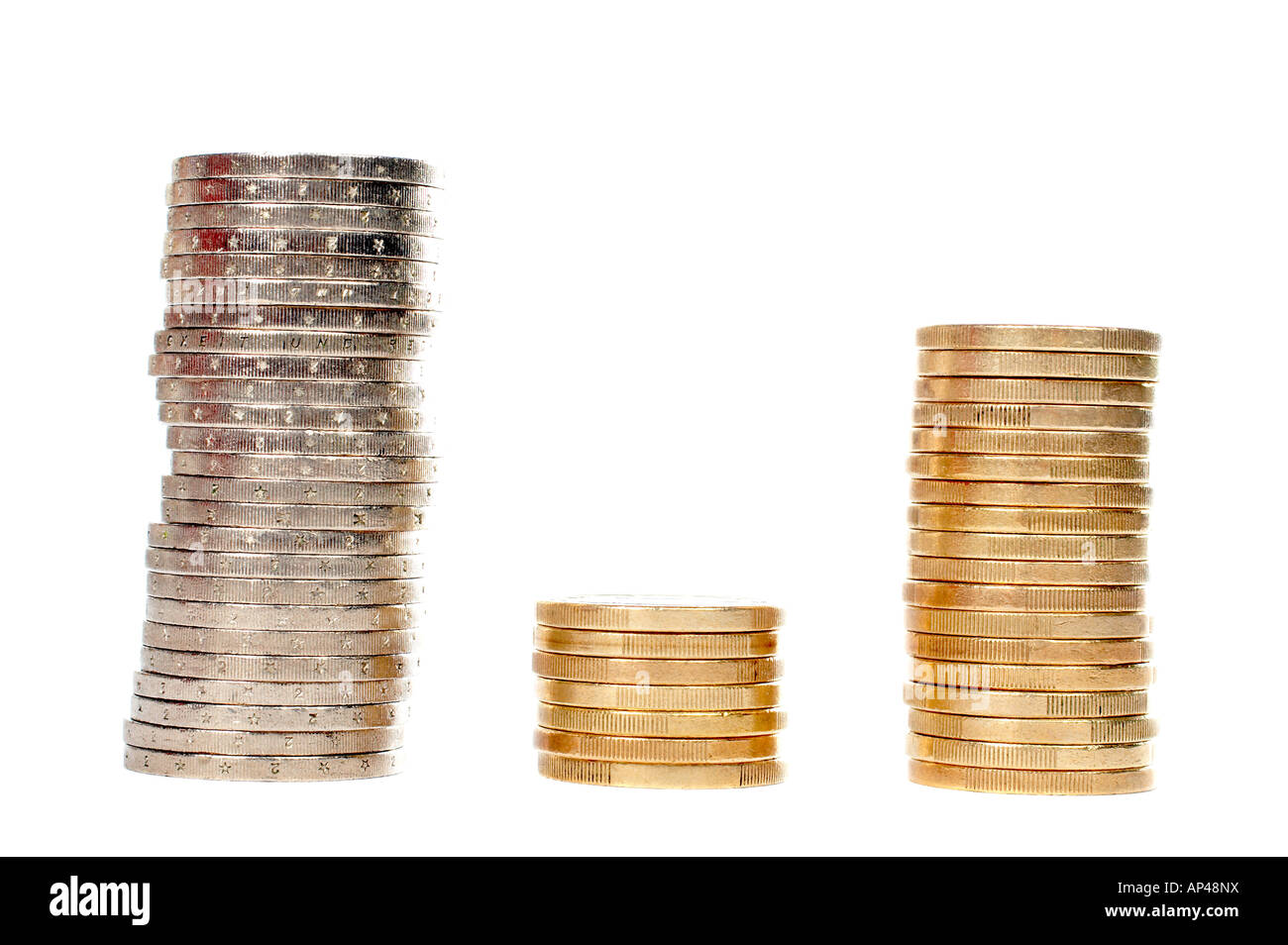 Vertical stacks of coins on white background Stock Photo - Alamy