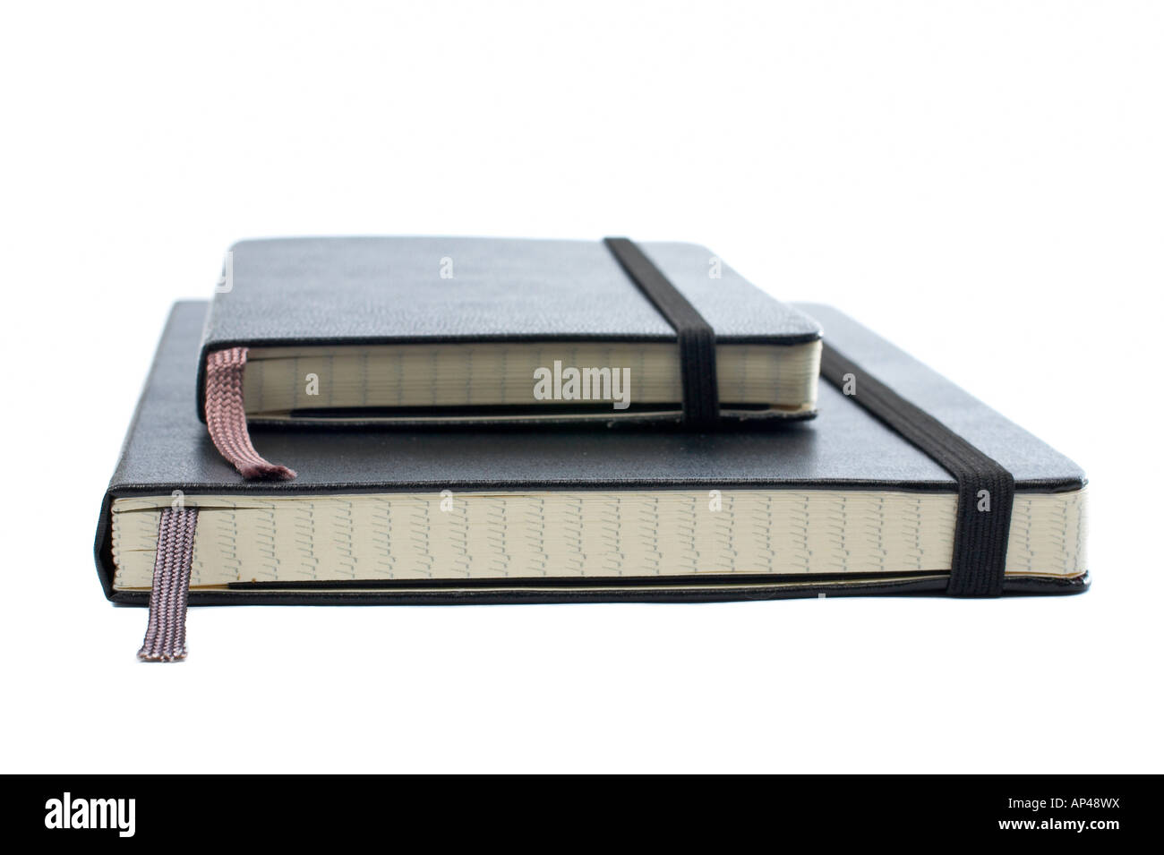 Two blacks notebooks with soft shadow on white background Small DOF ...