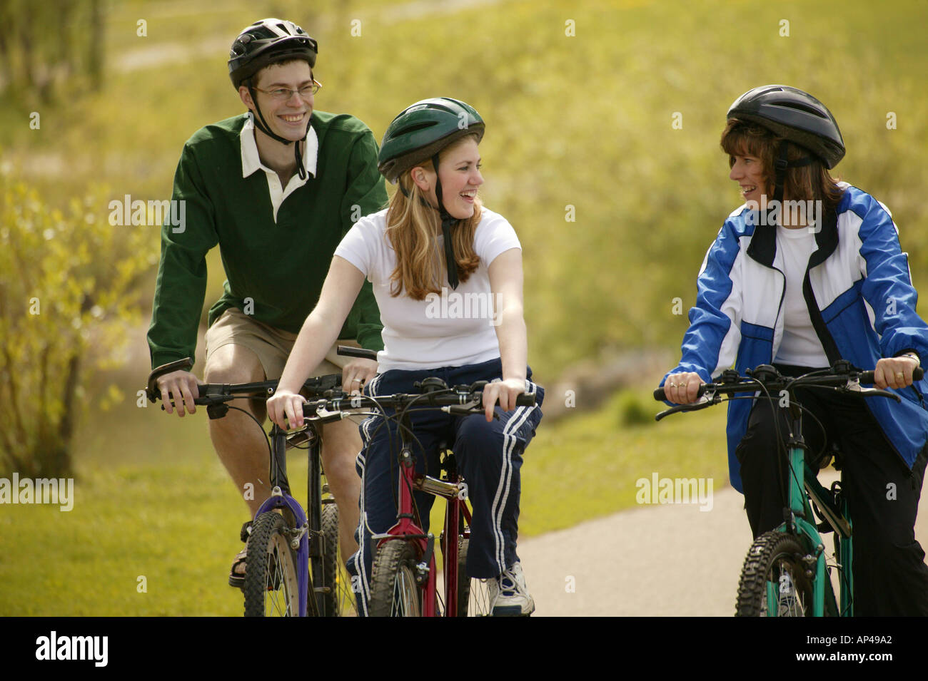 Friends cycling together Stock Photo - Alamy