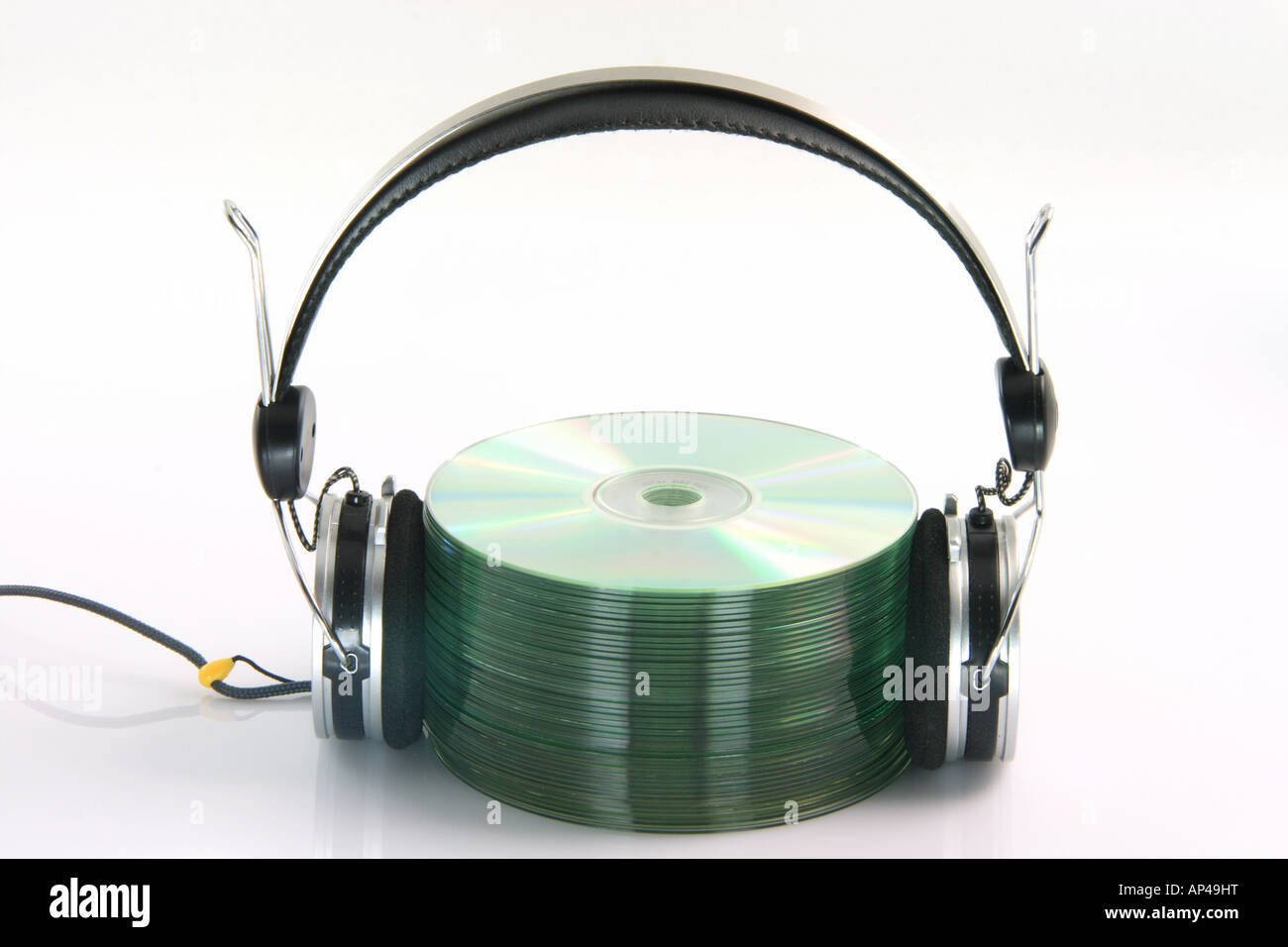 headphones and pile of compact discs isolated on white background Stock ...