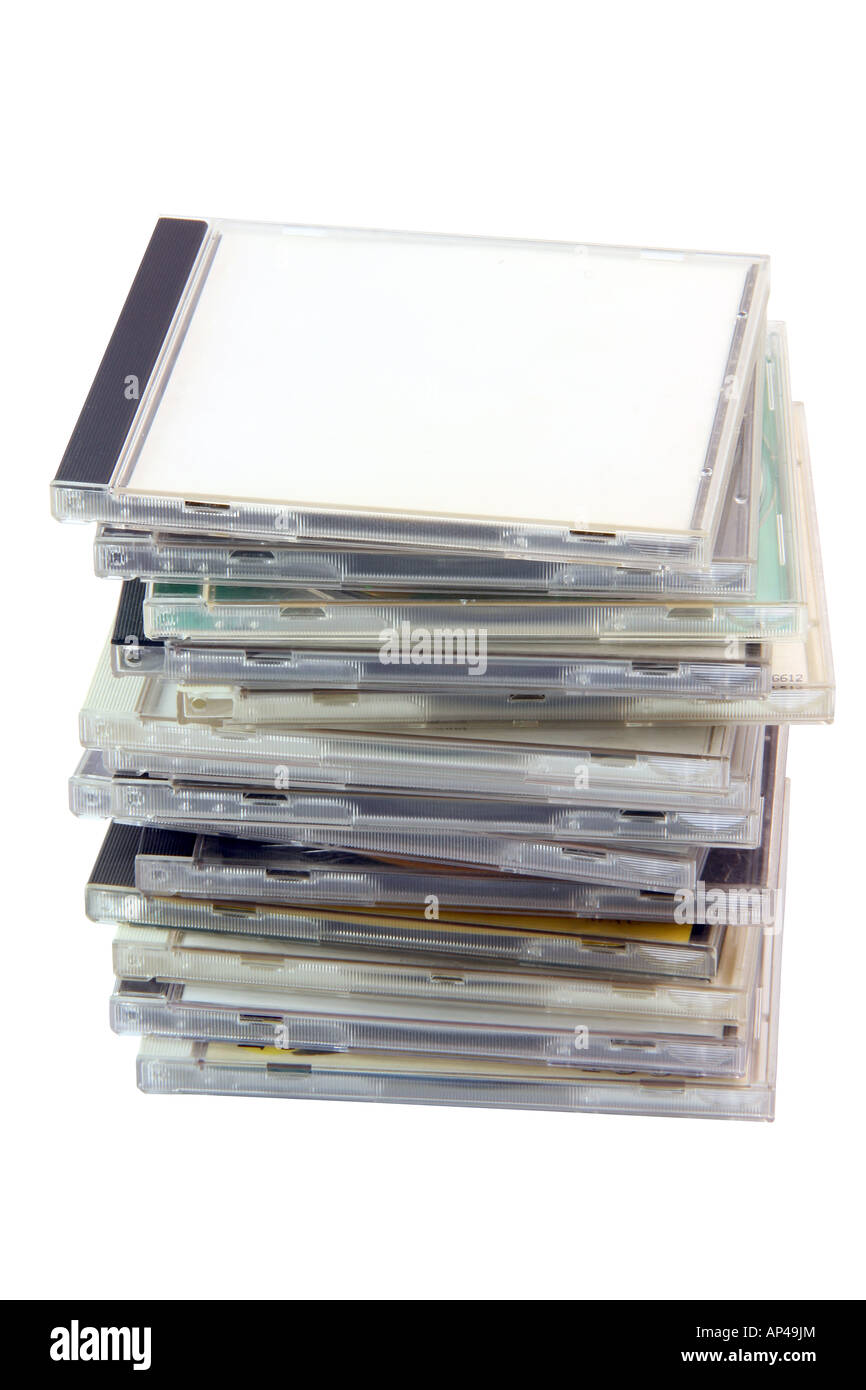 pile of cd cases isolated on white background and empty label to add ...