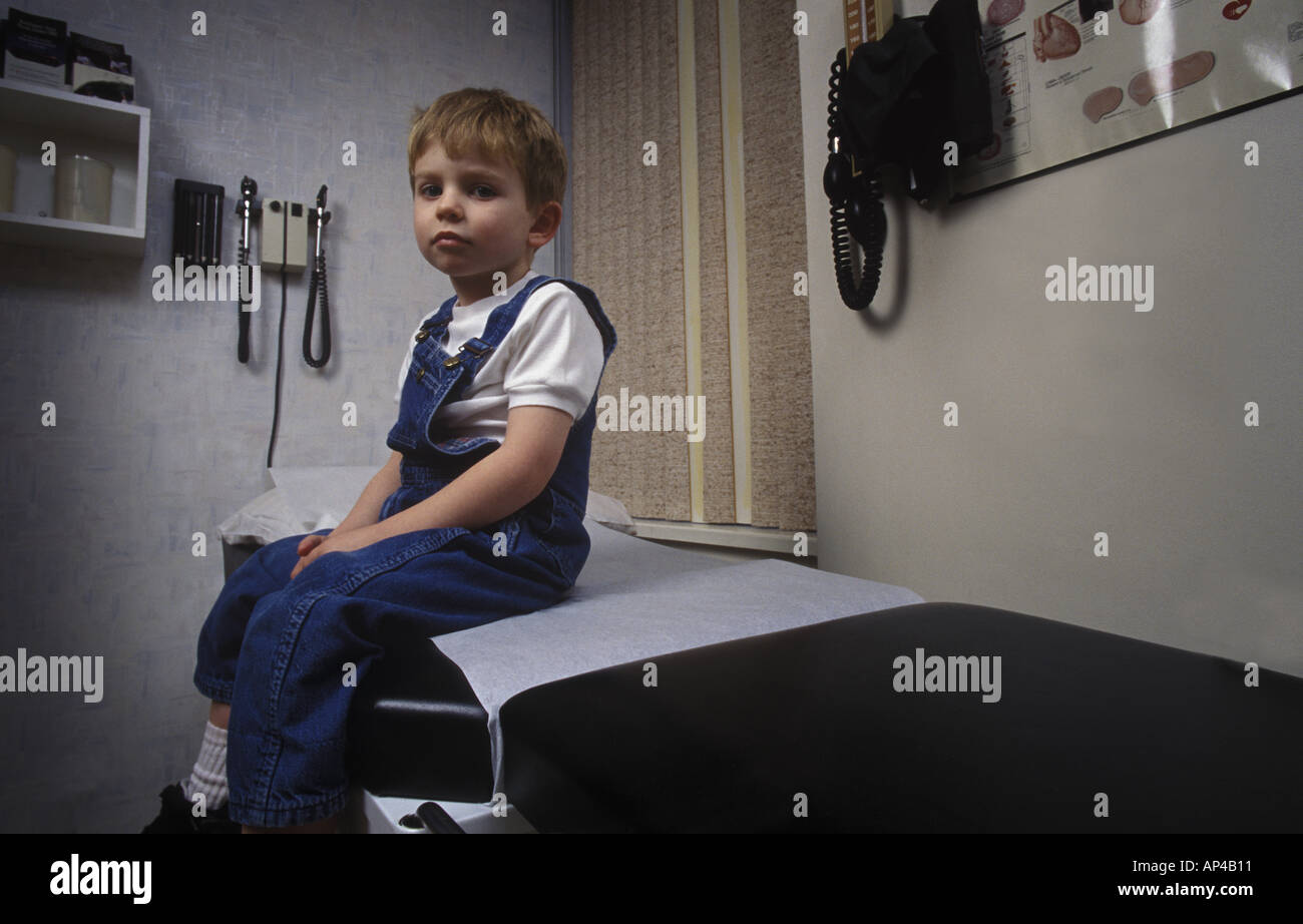 Boy sitting on examination table hi-res stock photography and images ...