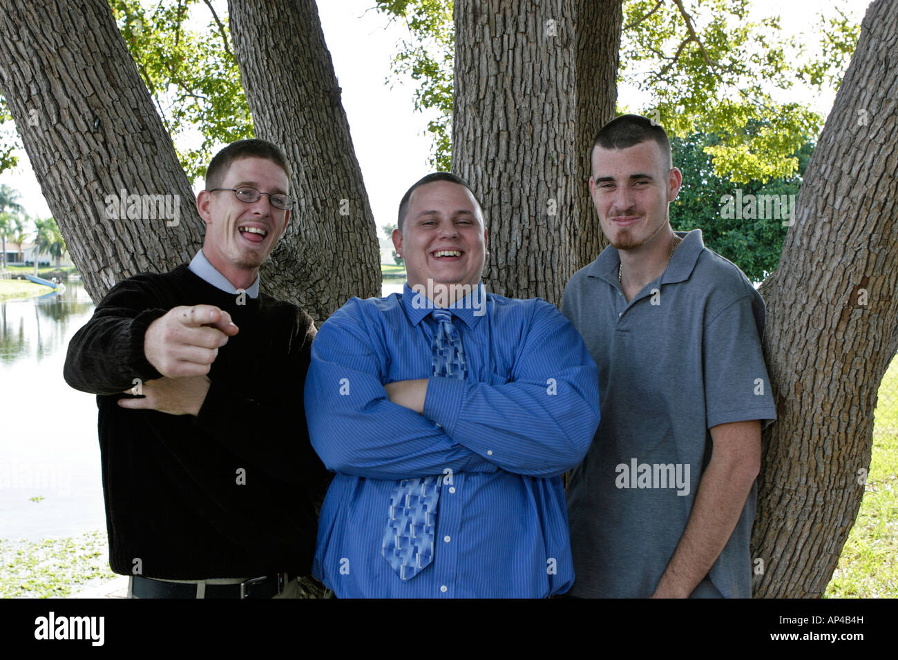 Three Young Men Posing and Laughing Stock Photo - Alamy