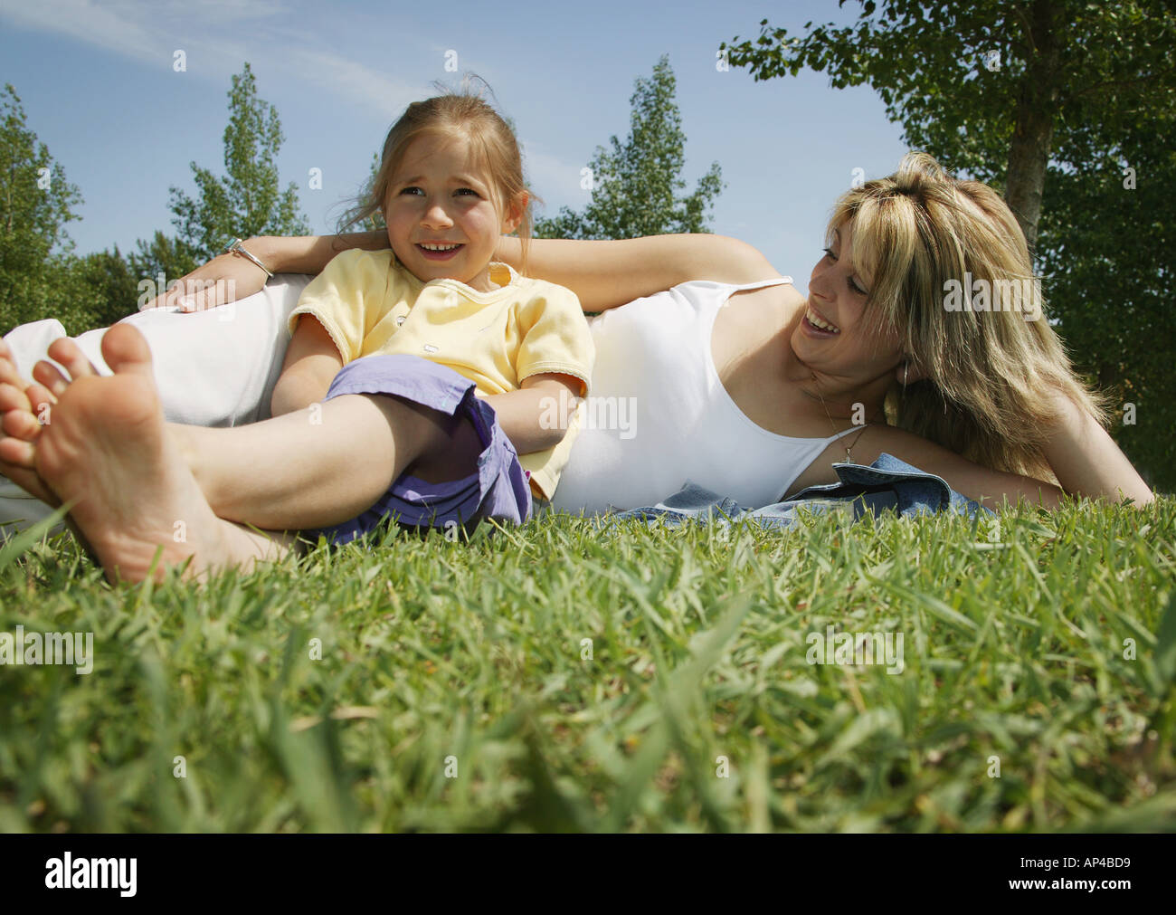 Mother and daughter lay together Stock Photo - Alamy