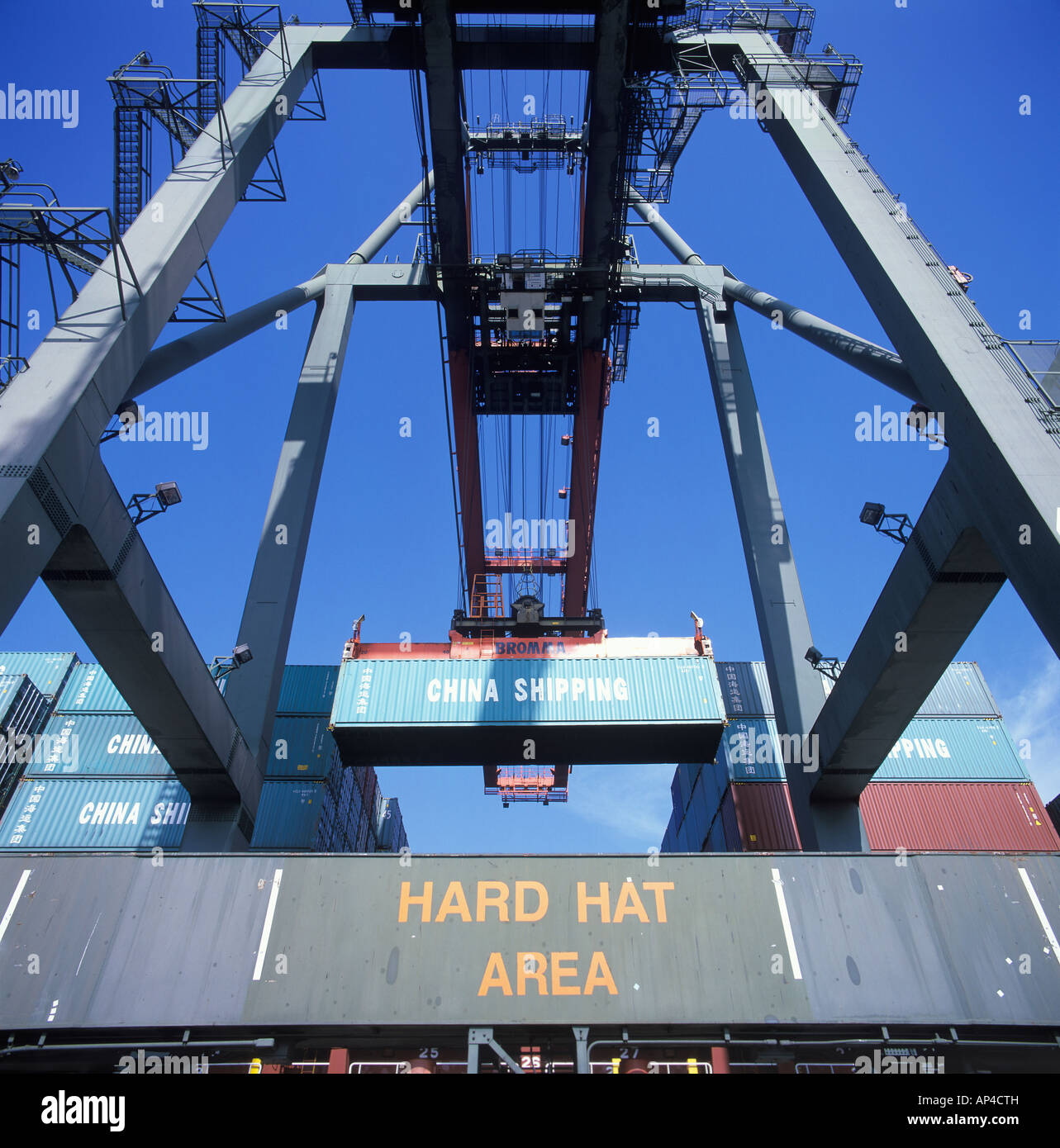 Shipping container being transported onto a container ship Stock Photo ...