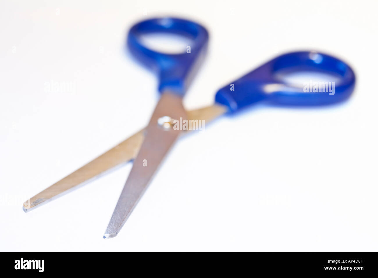 Open pair of scissors on a stark white background Stock Photo - Alamy