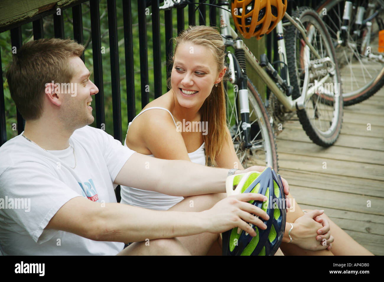 Couple taking a break after bike ride Stock Photo - Alamy