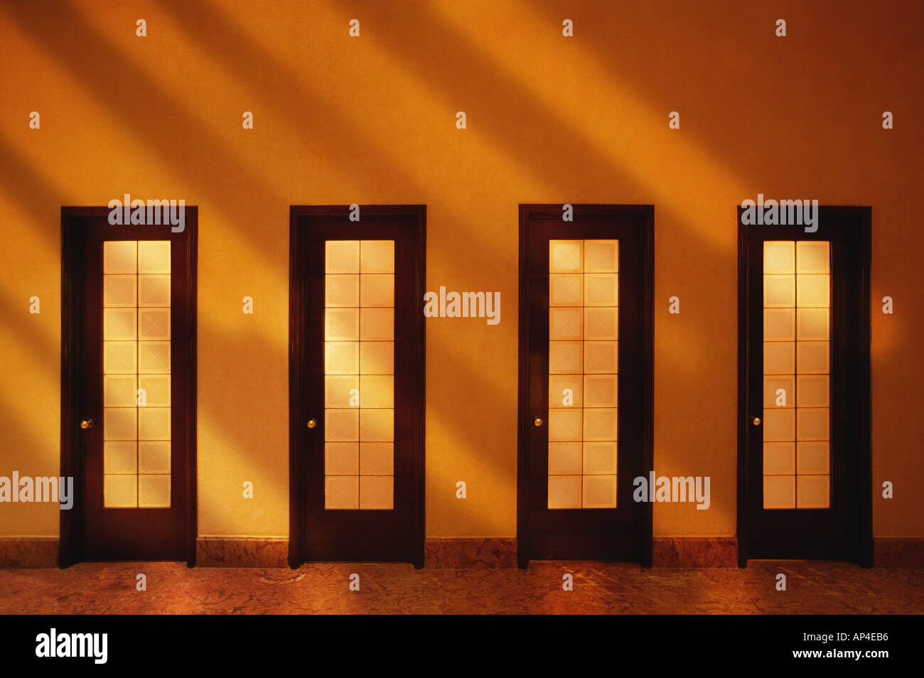 Four doors in a room Stock Photo - Alamy
