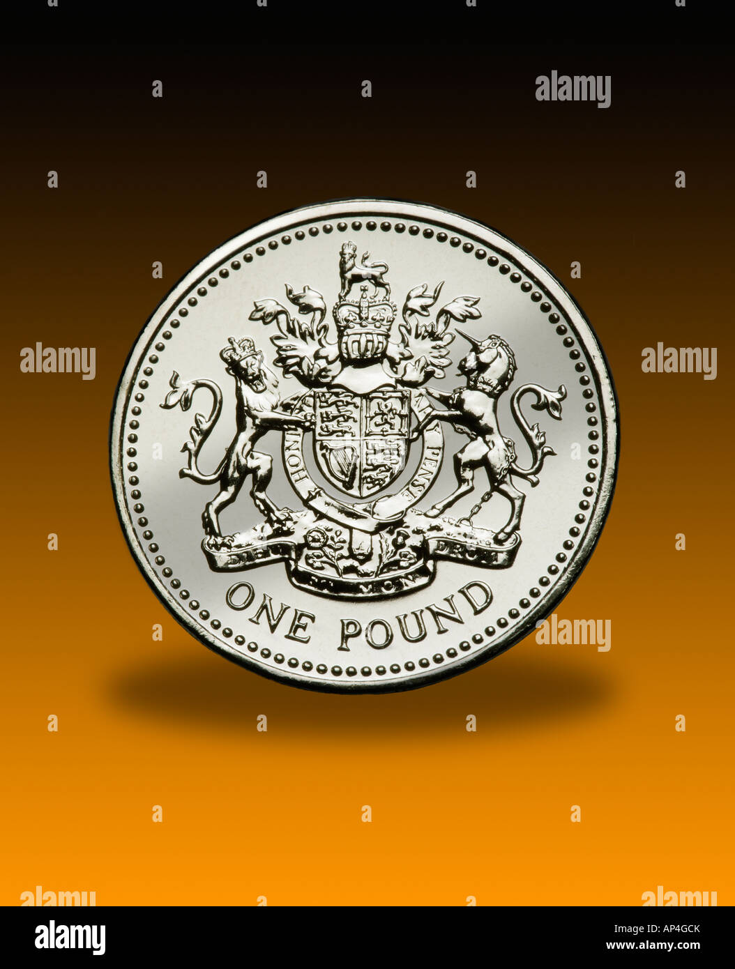 Pound coin on black to yellow blended background Stock Photo - Alamy