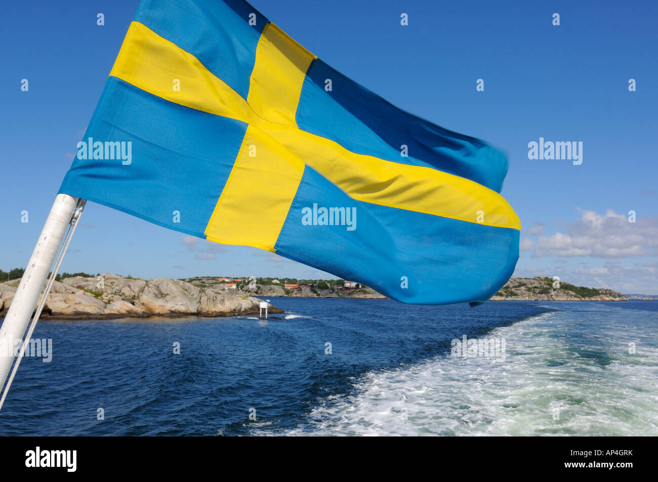 Swedish flag at the rear of a motor boat Stock Photo - Alamy
