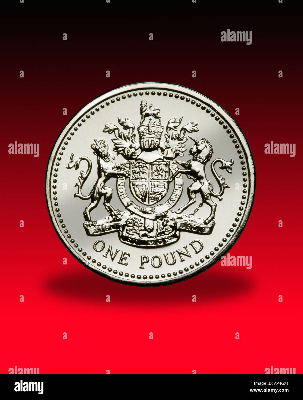 Pound coin on black to red blended background Stock Photo - Alamy