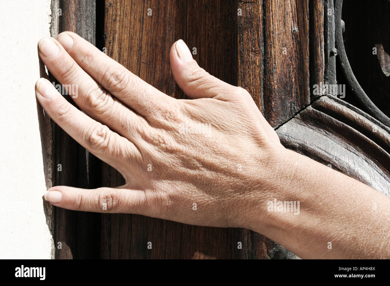 Hand at the Door Stock Photo - Alamy