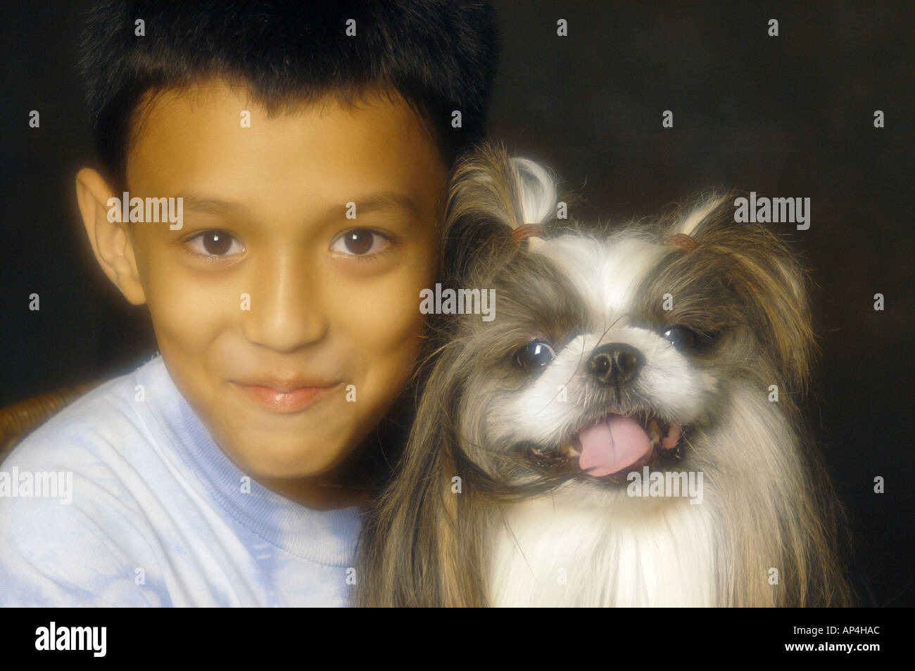 A boy named Caloy with his dog, Guber pose for their portrait Stock ...