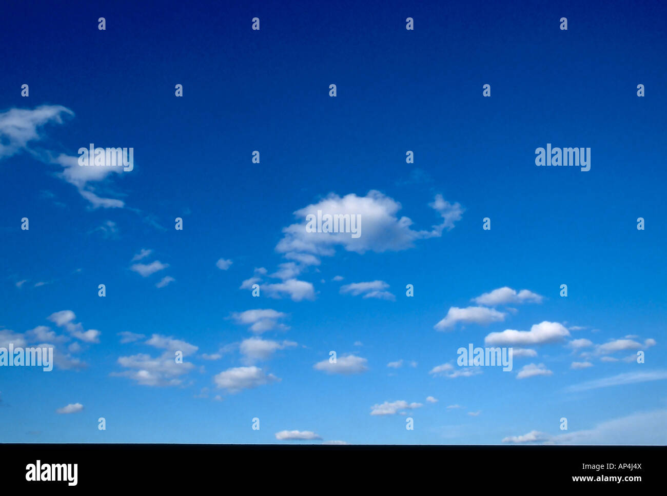 A perfect blue sky with small puffy white cumulus clouds Stock Photo ...