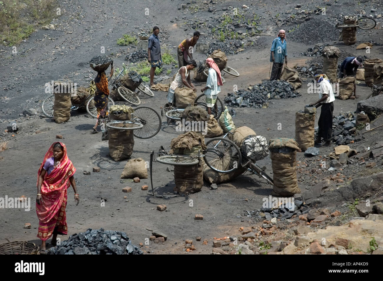 Workers collecting coal from abandoned mines near Dhanbad, India Stock ...