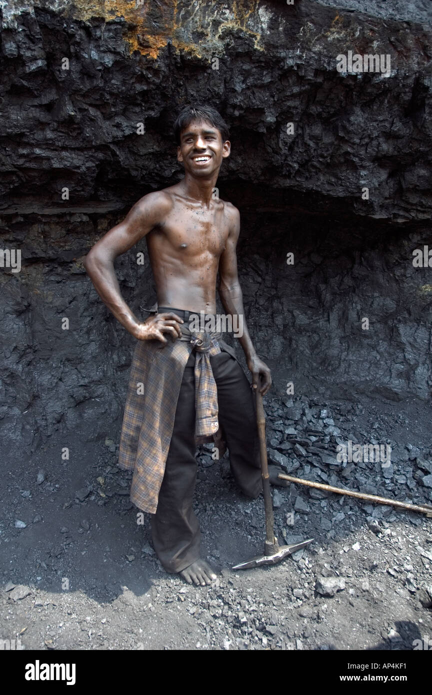 Portrait of a smiling, barechest miner in one of Dhanbad's unauthorised ...