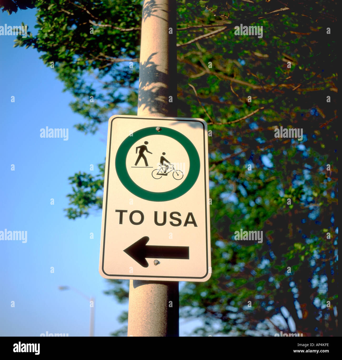 A sign for cyclists and pedestrians indicating the direction to the ...