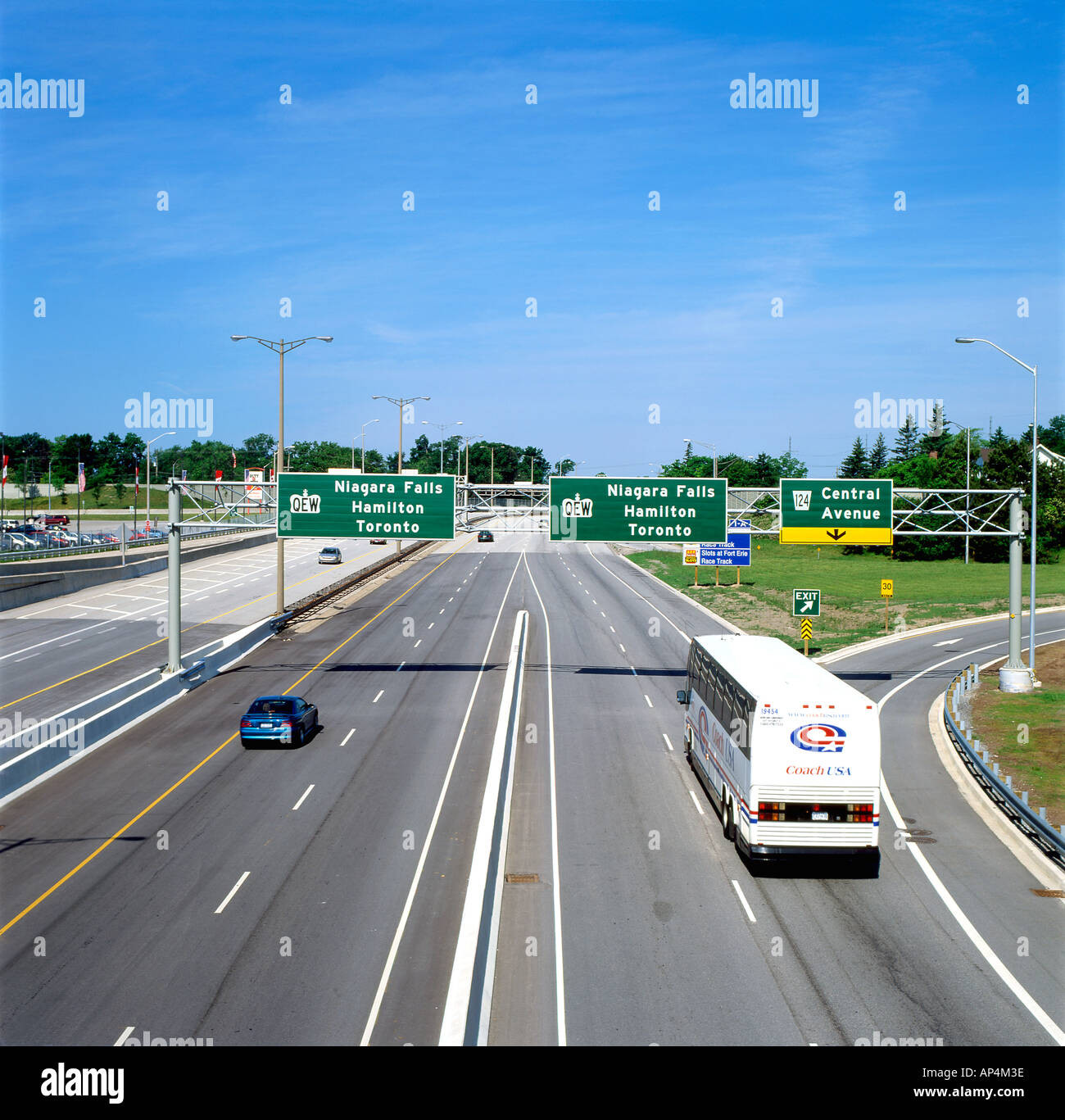 A bus on the QEW Queen Elizabeth Highway and road signs in Fort Erie ...