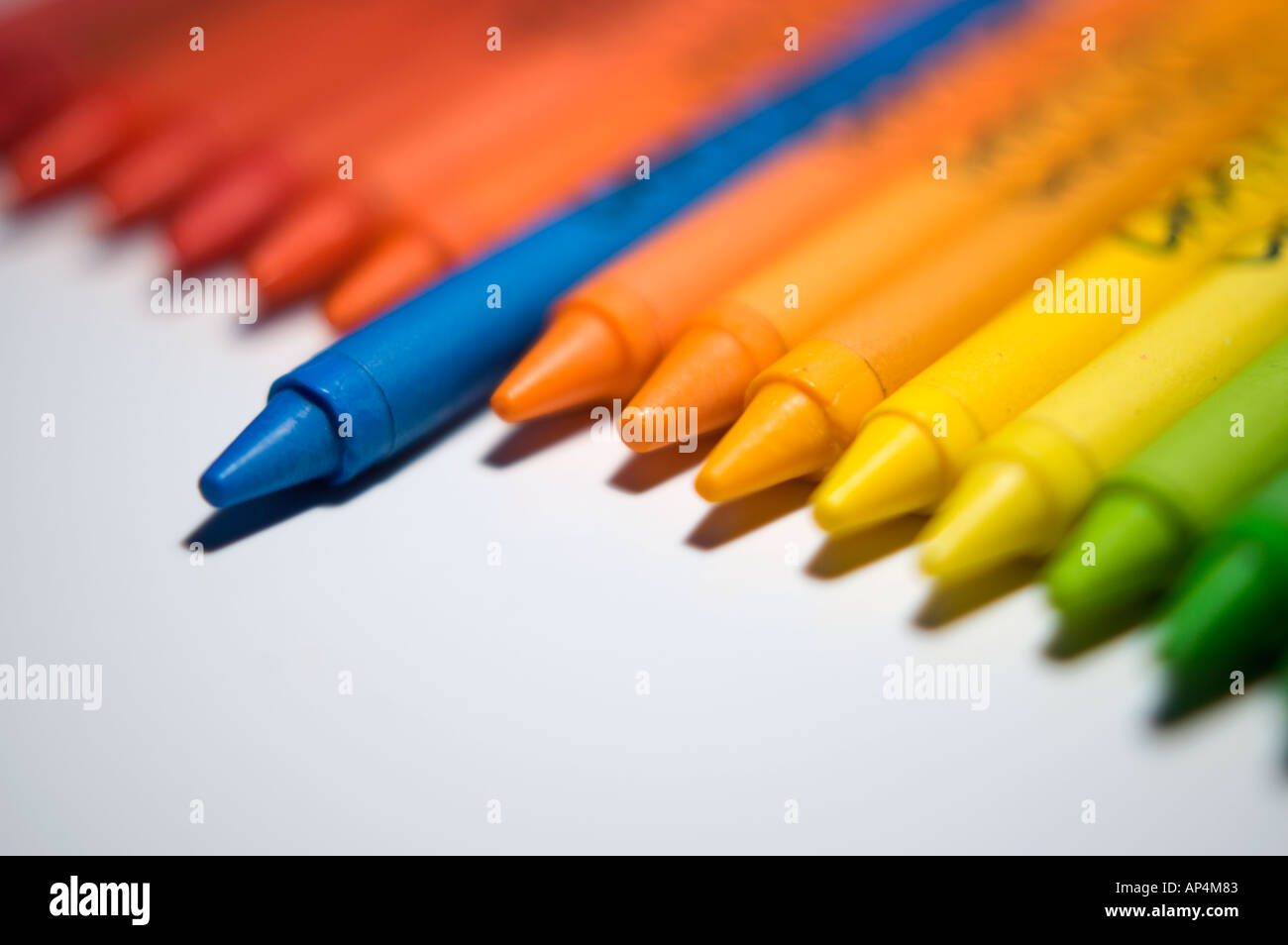 Individuality blue crayon stands out in a row of colored crayons Stock ...