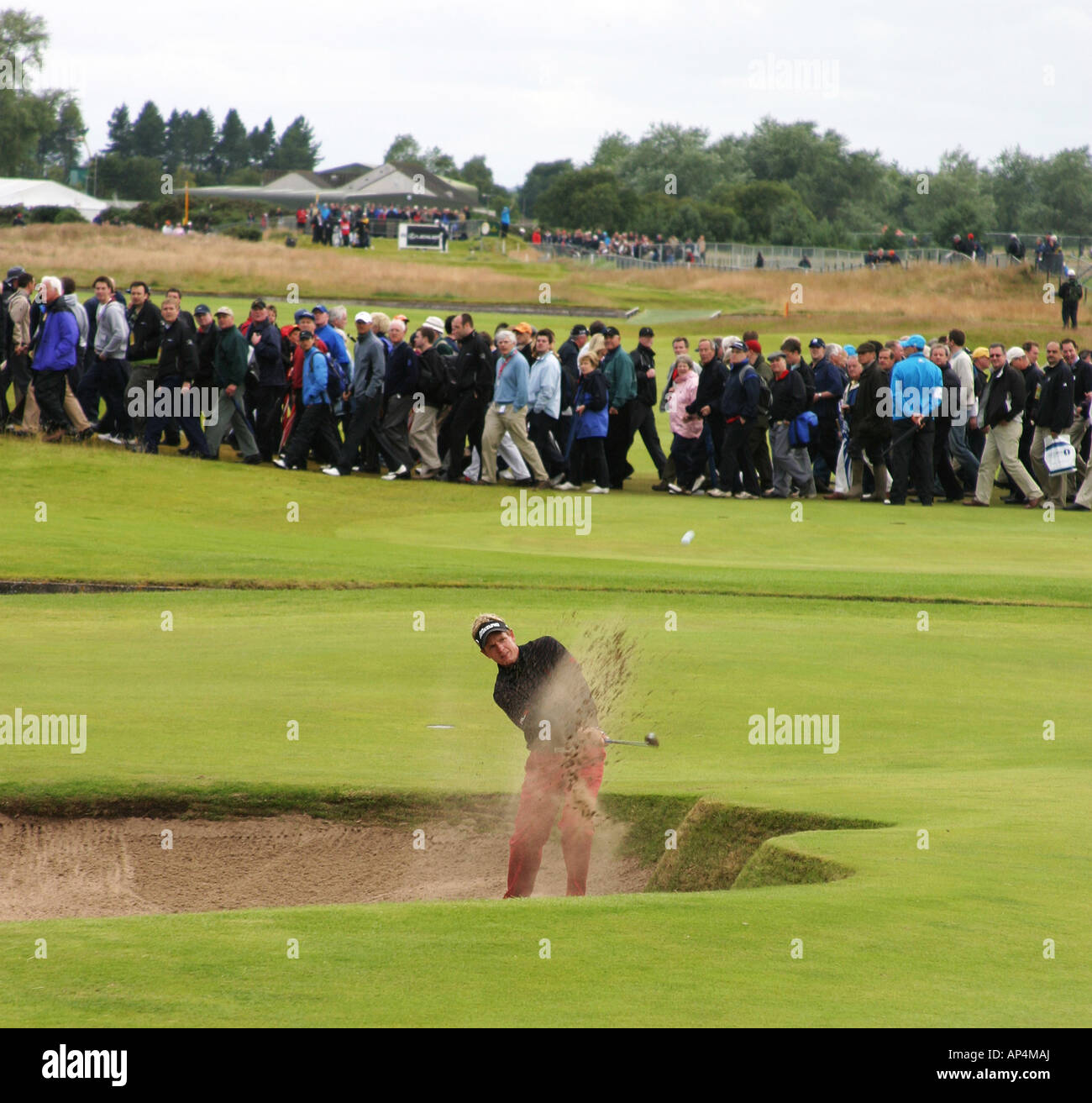 Luke Donald plays a bunker shot at the 18th green at the 2007 British ...