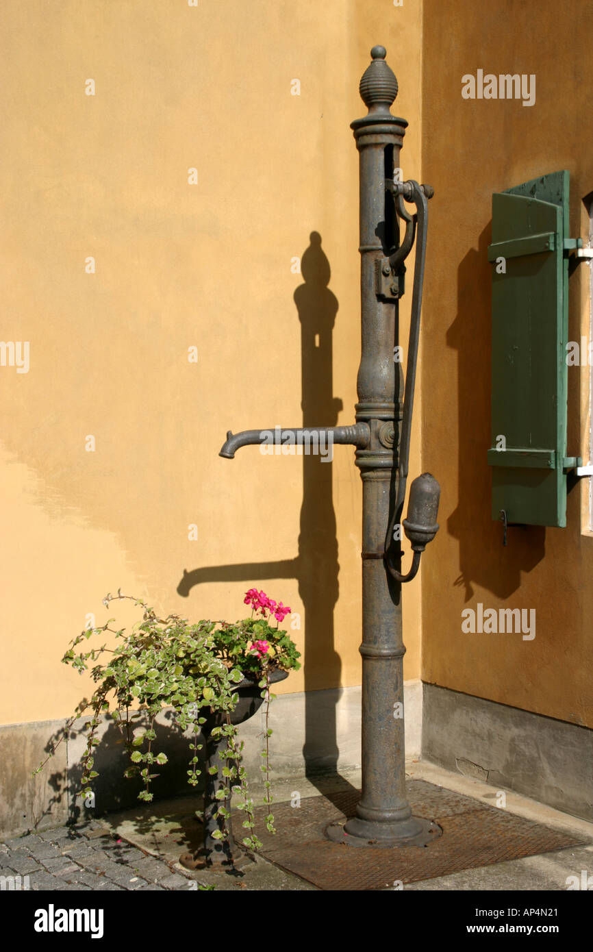 Old hand water pump at the Fuggerei oldest social settlement in the ...